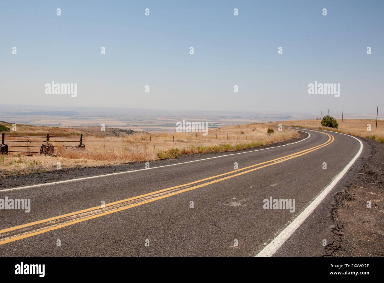 A winding road meanders through Pendleton, Oregon, tracing the contours ...