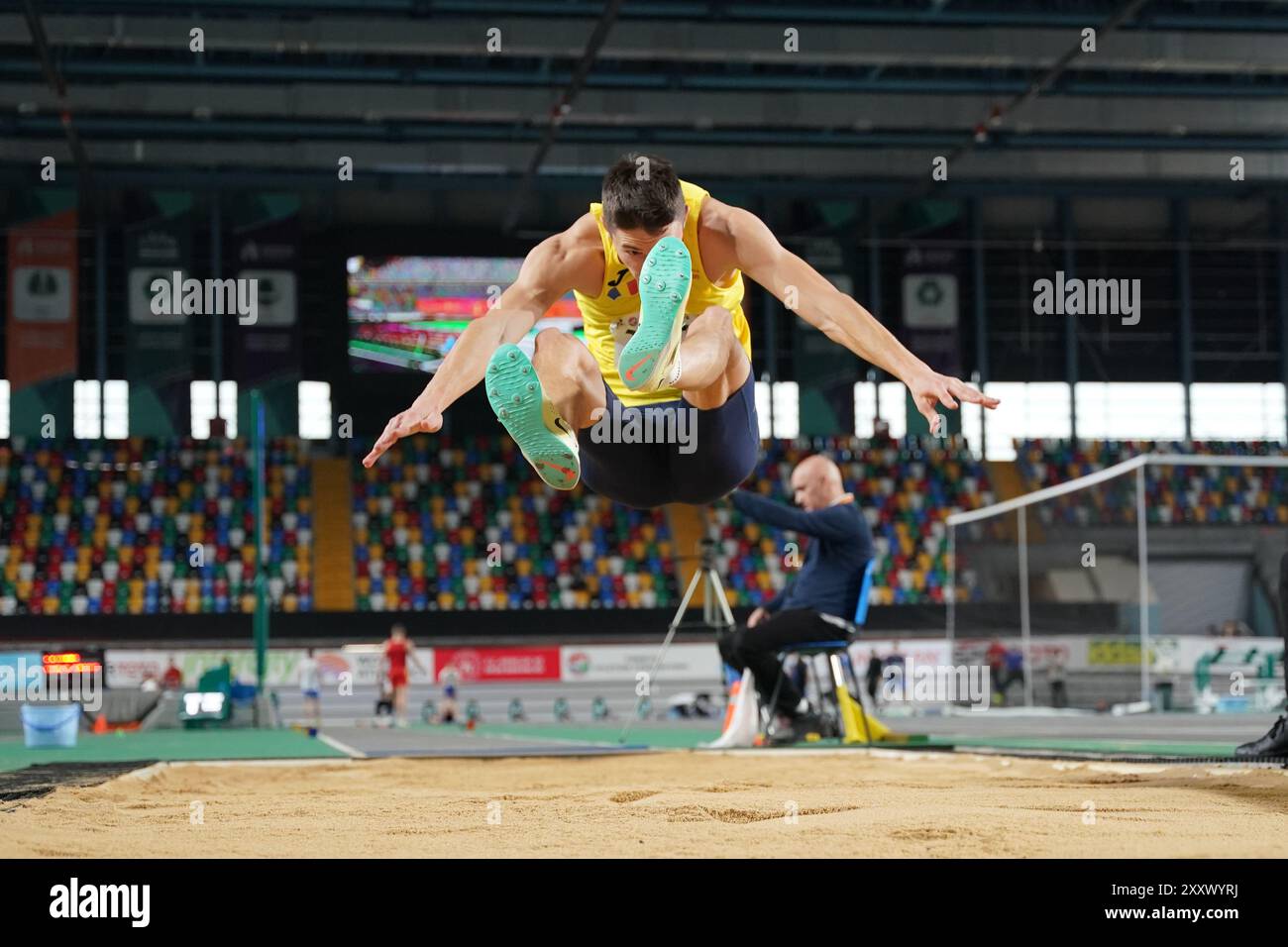 ISTANBUL, TURKIYE - FEBRUARY 10, 2024: Undefined athlete long jumping ...