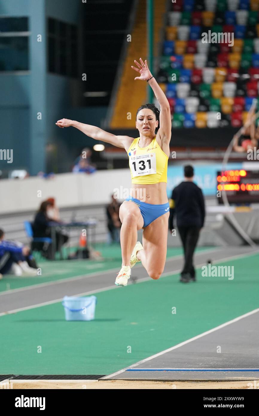 ISTANBUL, TURKIYE - FEBRUARY 10, 2024: Undefined athlete long jumping ...
