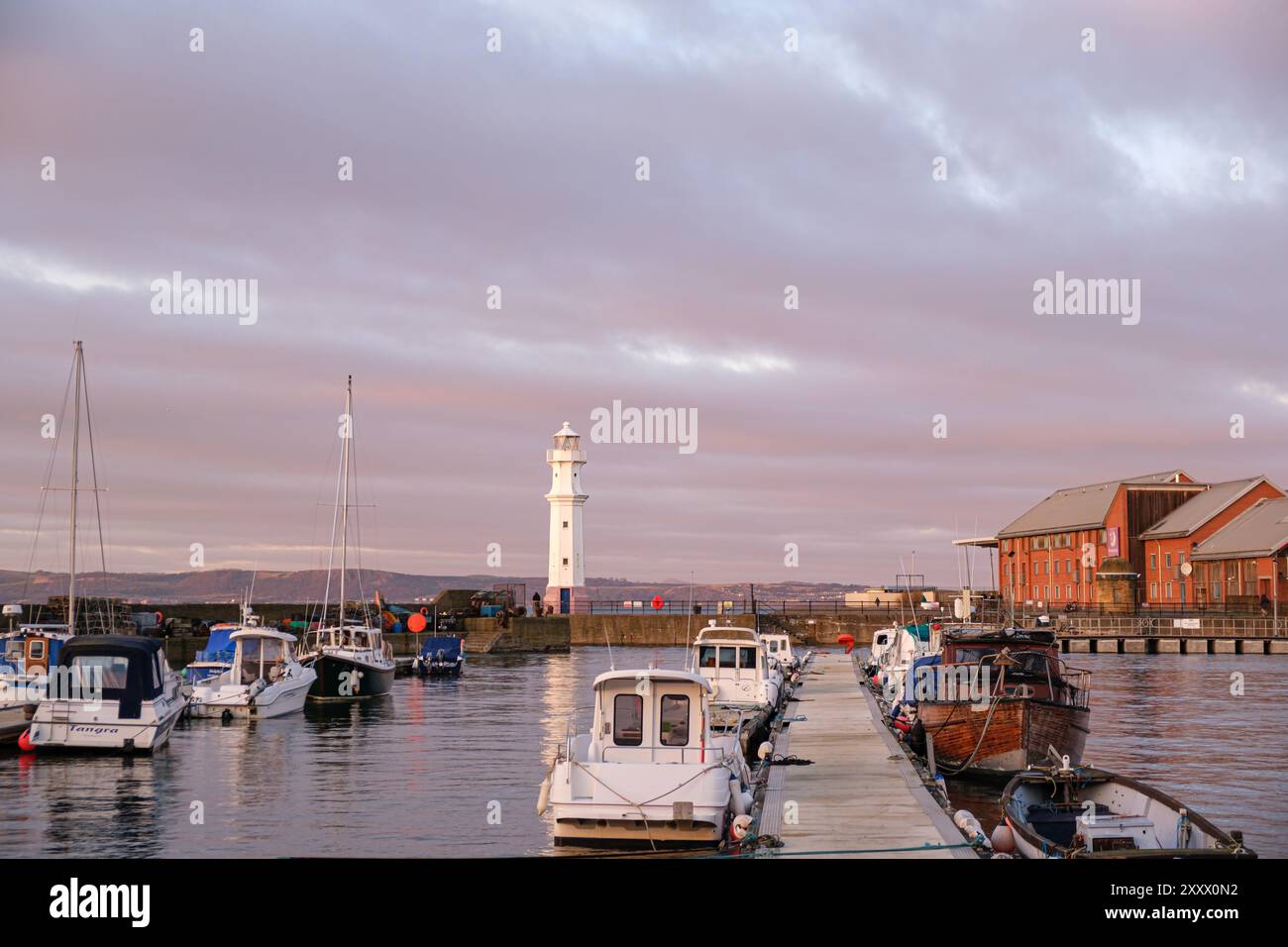 EDINBURGH - JANUARY 13, 2024: Serene sunset over Newhaven Harbour ...