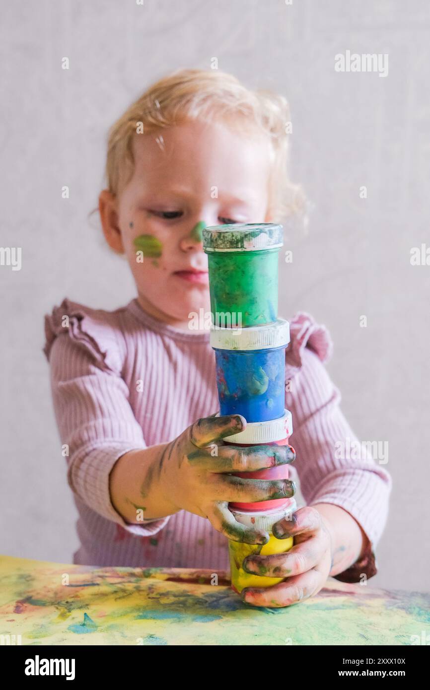 Female toddler drawing at table Stock Photo - Alamy