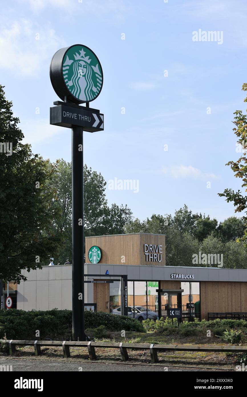 Starbucks drive through and sign and trees in the background in ...
