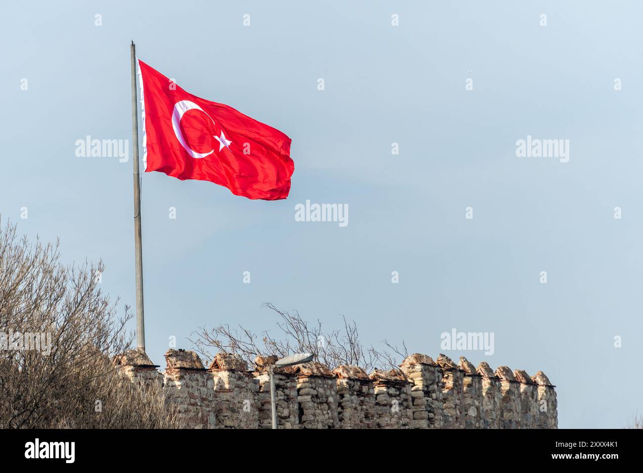 Turkish national flag hang on a pole on sky background Stock Photo - Alamy