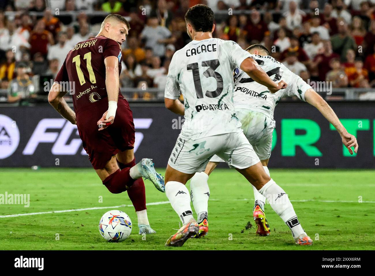 Artem Dovbyk of AS Roma is challenged by Liberato Cacace and Ardian ...