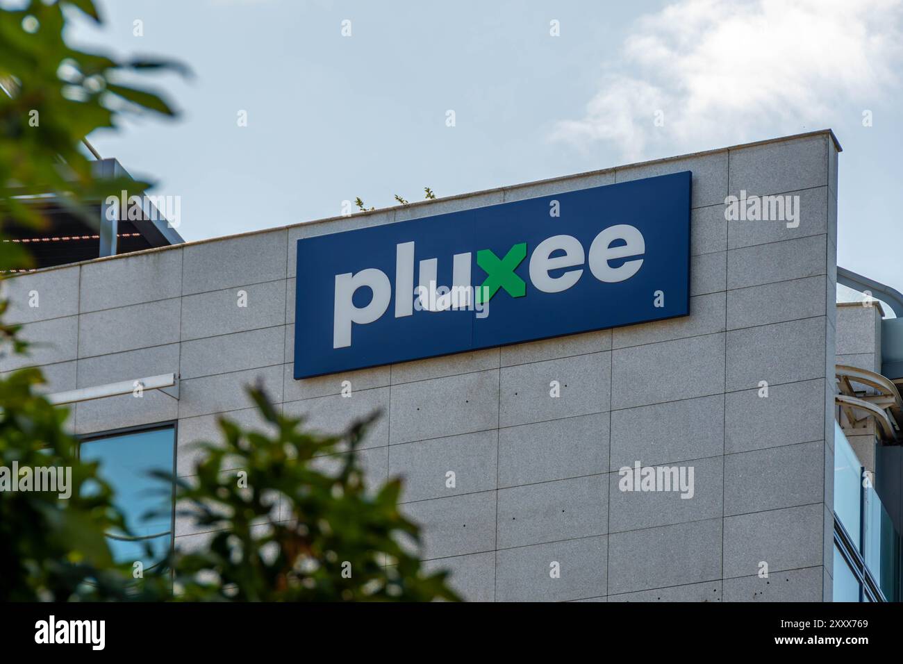 Sign and logo on the headquarters of Pluxee International, a French ...