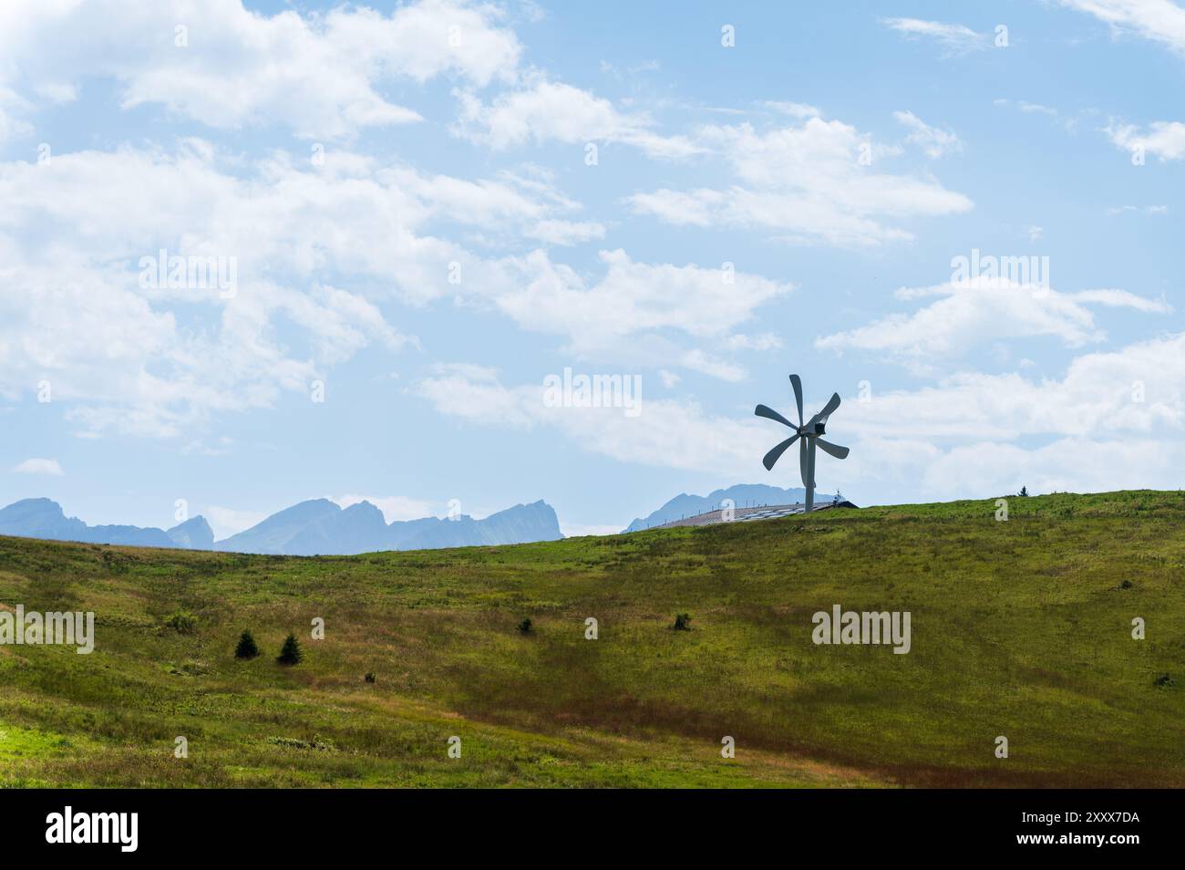 Wind turbine and solar panel on meadow in Switzerland Stock Photo - Alamy