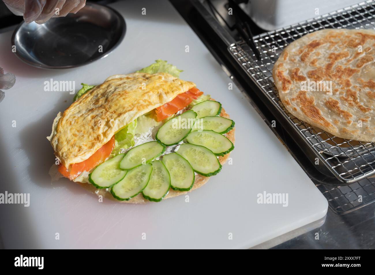 Flatbread stuffed with fish and cheese. Quesadilla Stock Photo - Alamy