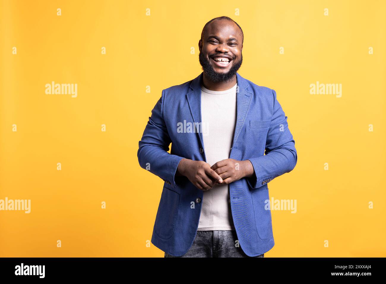 Joyful african american man laughing while posing, feeling happy ...