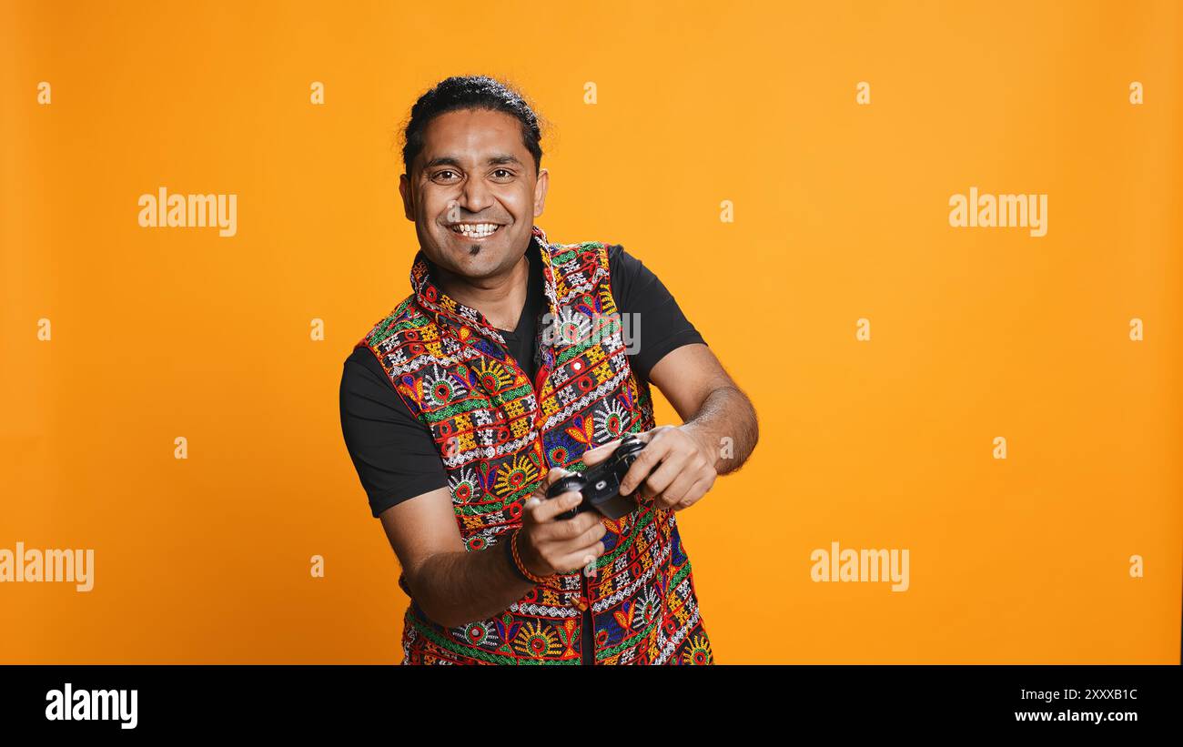 Happy gamer celebrating after winning game on gaming console, studio ...