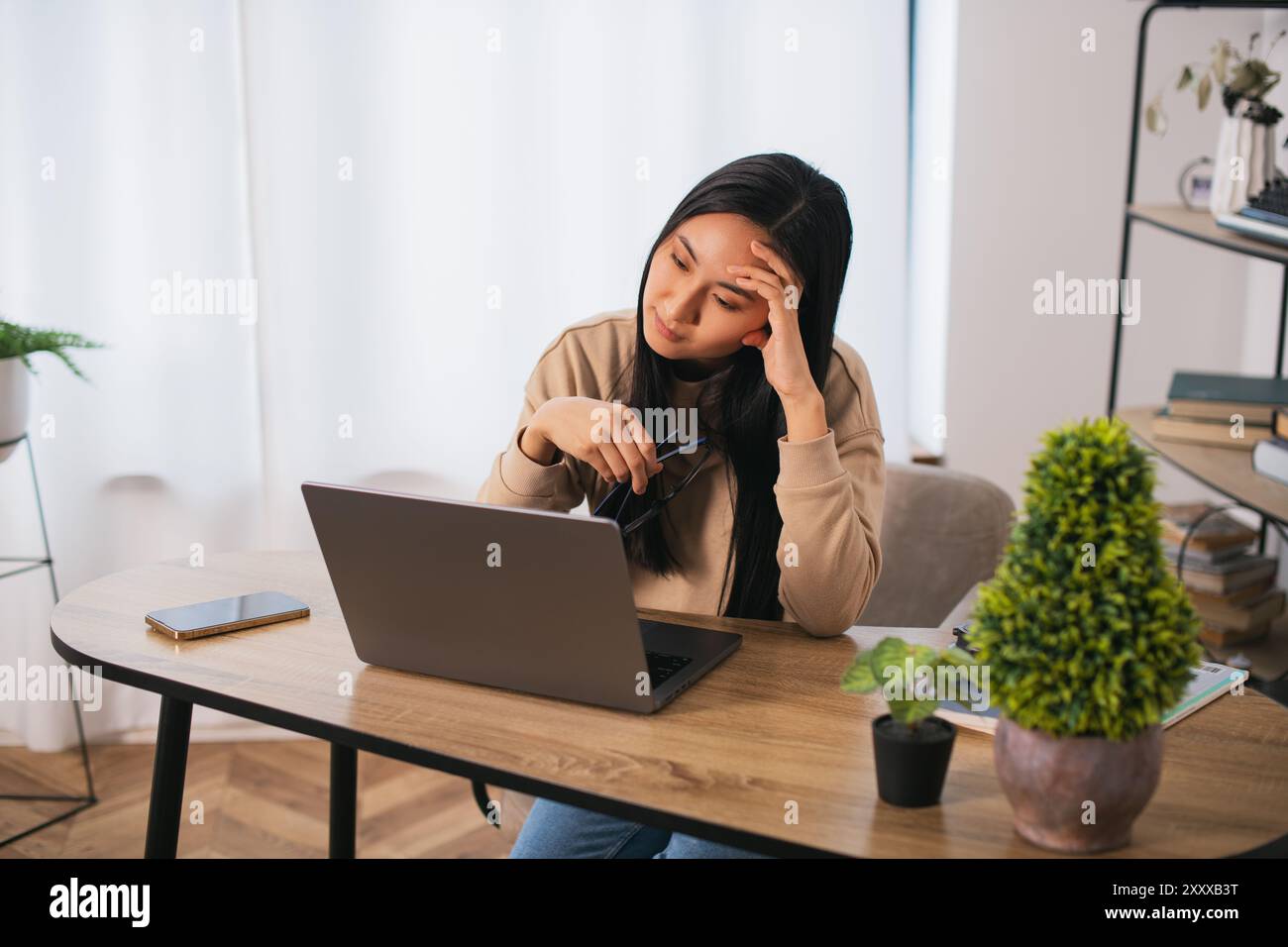 Tired Young Asian Korean woman worker student take short pause in ...