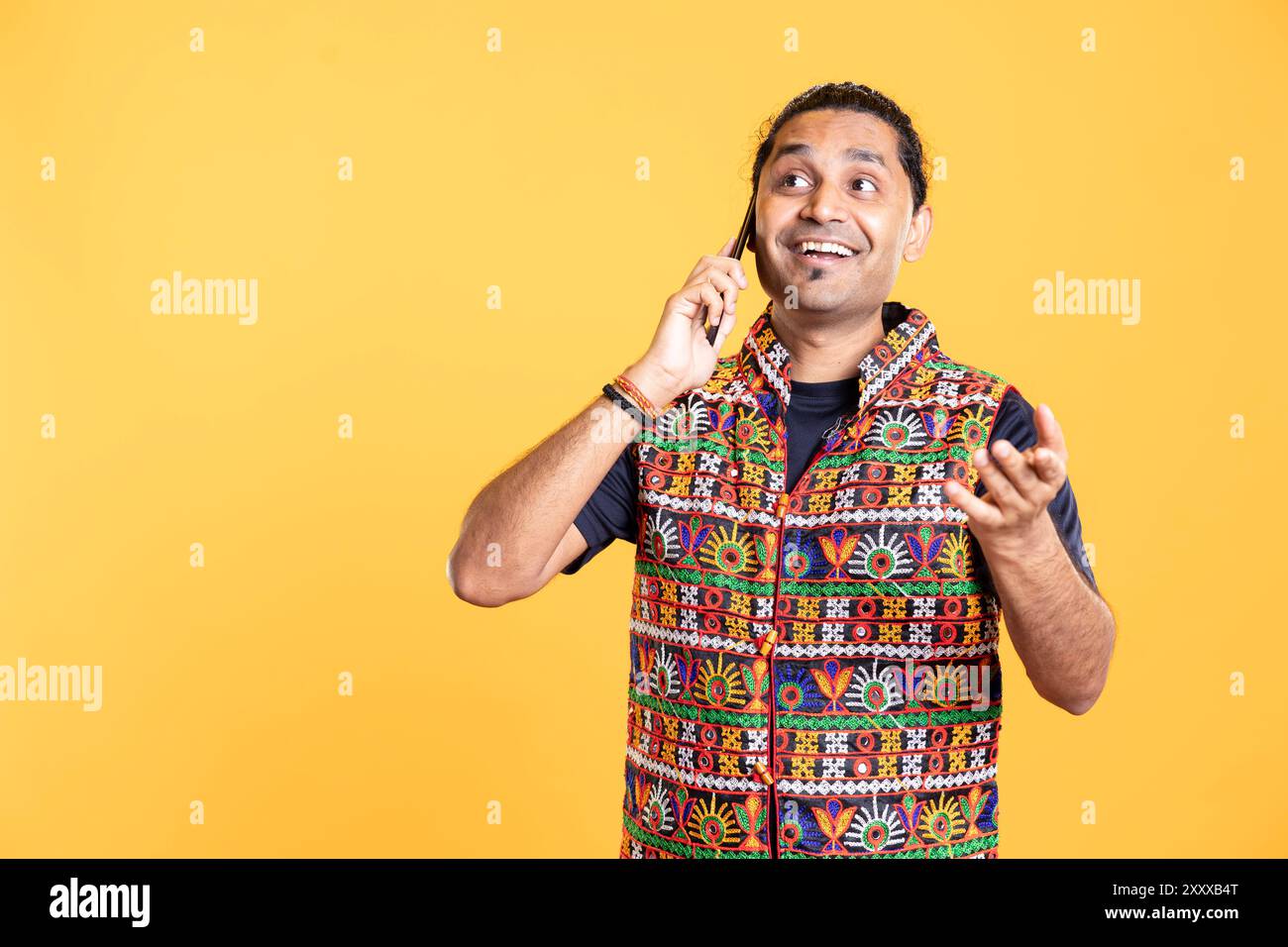 Joyful man happy to hear from best friend over telephone call using ...