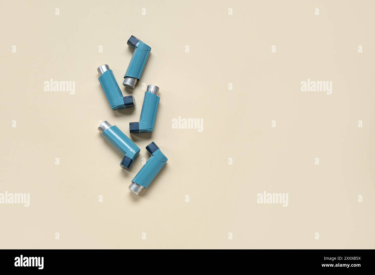 Asthma inhalers on beige background Stock Photo - Alamy