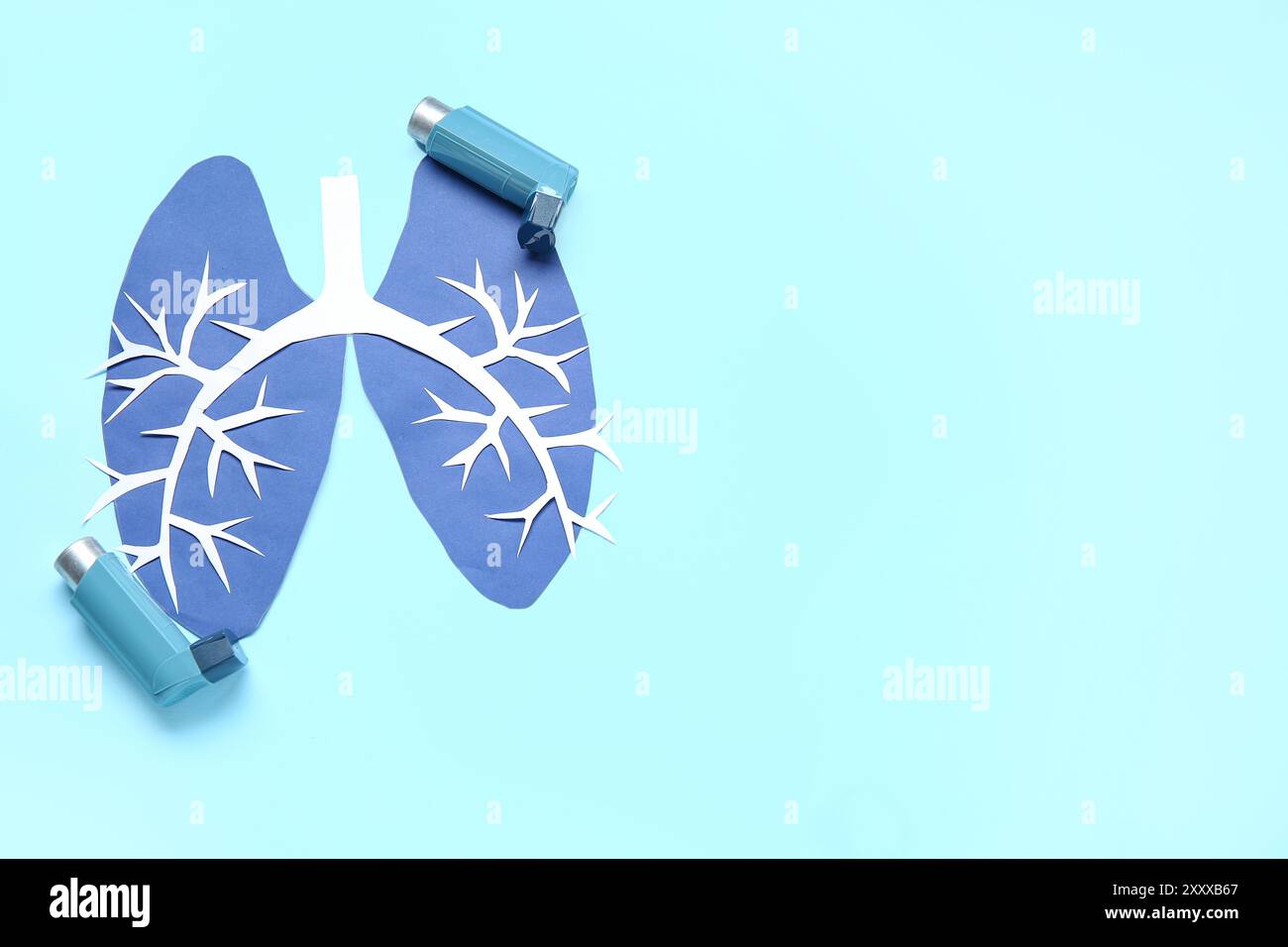 Paper lungs and asthma inhalers on blue background Stock Photo - Alamy
