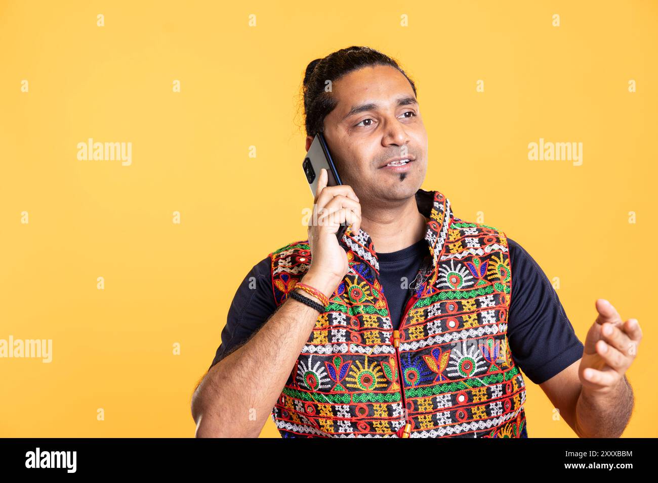 Smiling man chatting with friend over telephone call, enjoying ...