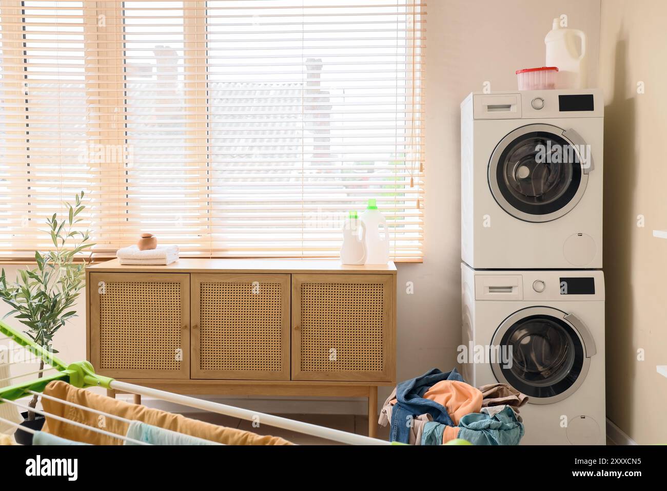 Interior of laundry room with dryer and washing machines Stock Photo ...