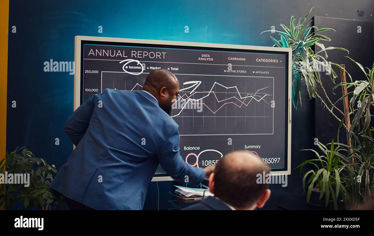 Chief operating officer presenting annual data reports in a conference ...