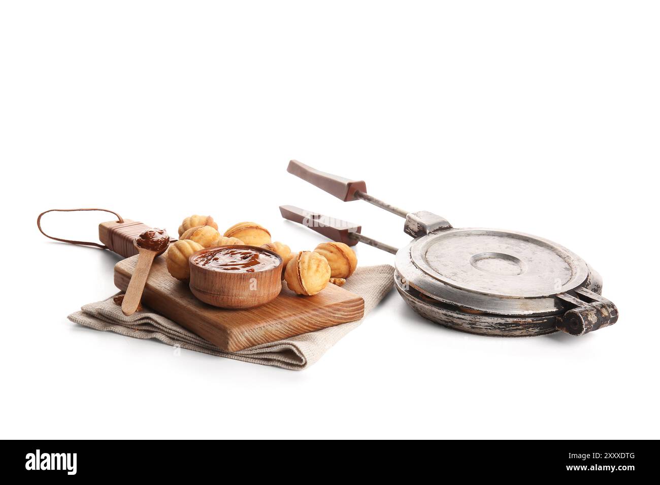 Baking form, walnut shaped cookies and boiled condensed milk on white ...