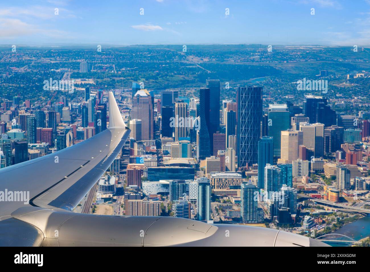 Aerial view of Calgary downtown skyline from window of airplane as it ...