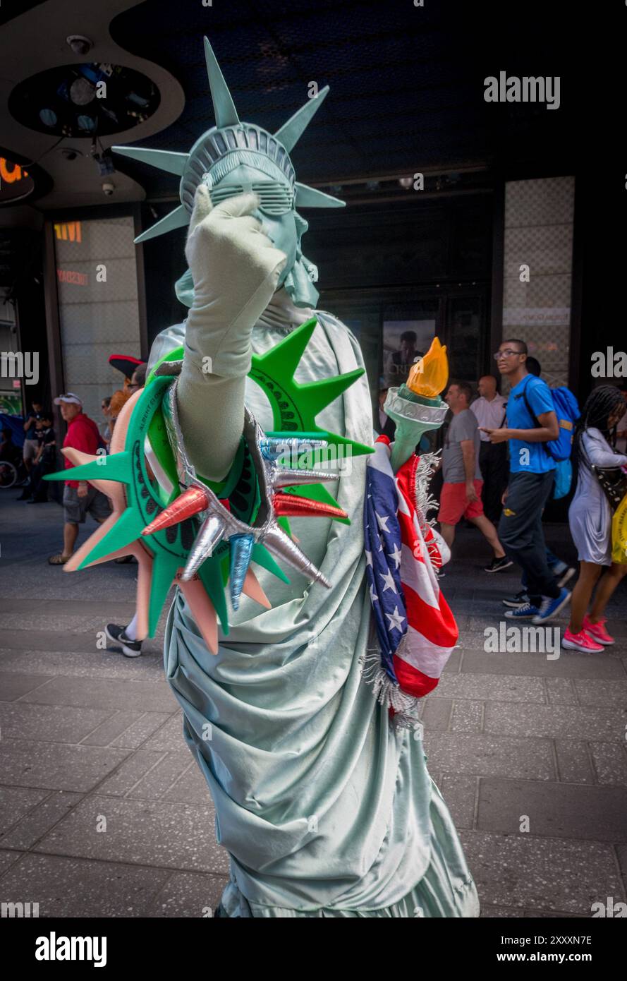 Statue of Liberty actor in Times Square, New York City giving a gesture ...