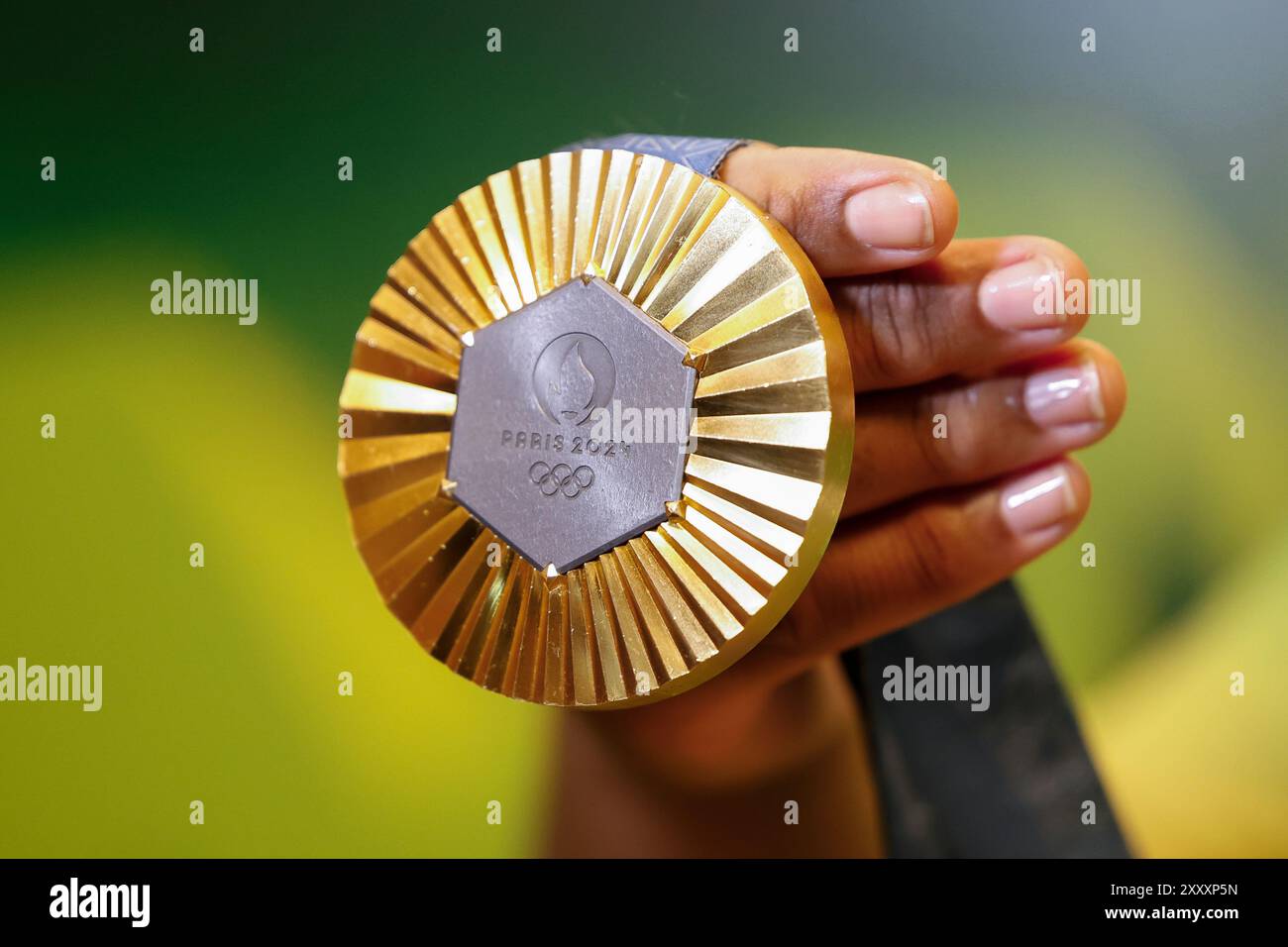 Gold medal of Paris 2024 Olympic Games handheld detail shot, sports ...