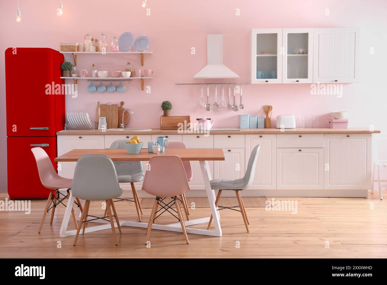 Red refrigerator in kitchen. Bright color accent in interior Stock ...