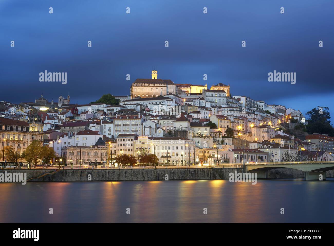 Coimbra city view at night with Mondego river and beautiful historic ...