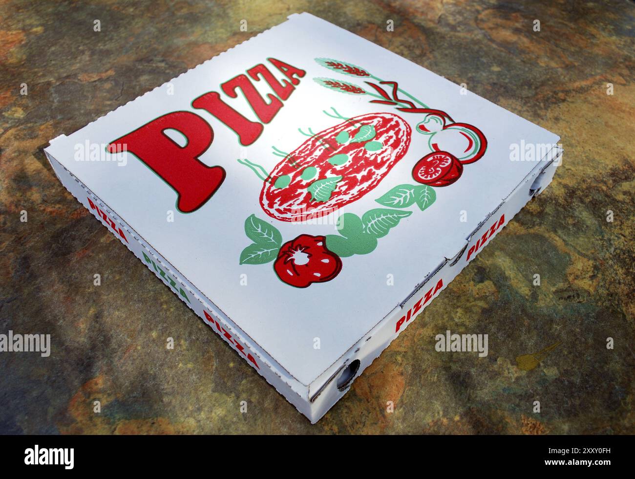 Pizza box lying on a marble table Stock Photo - Alamy