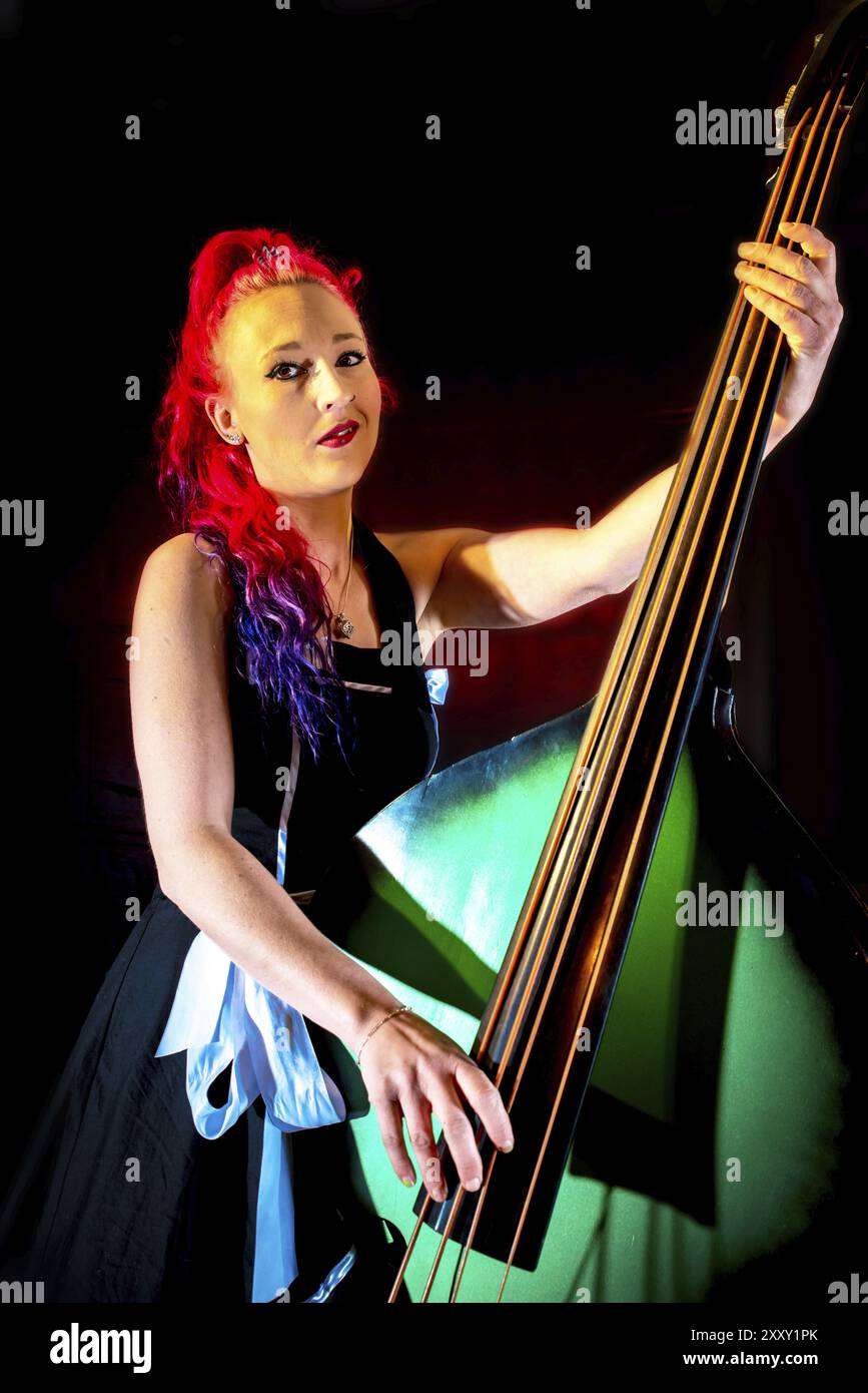 Rock'n'roll singer with red hair and double bass Stock Photo - Alamy
