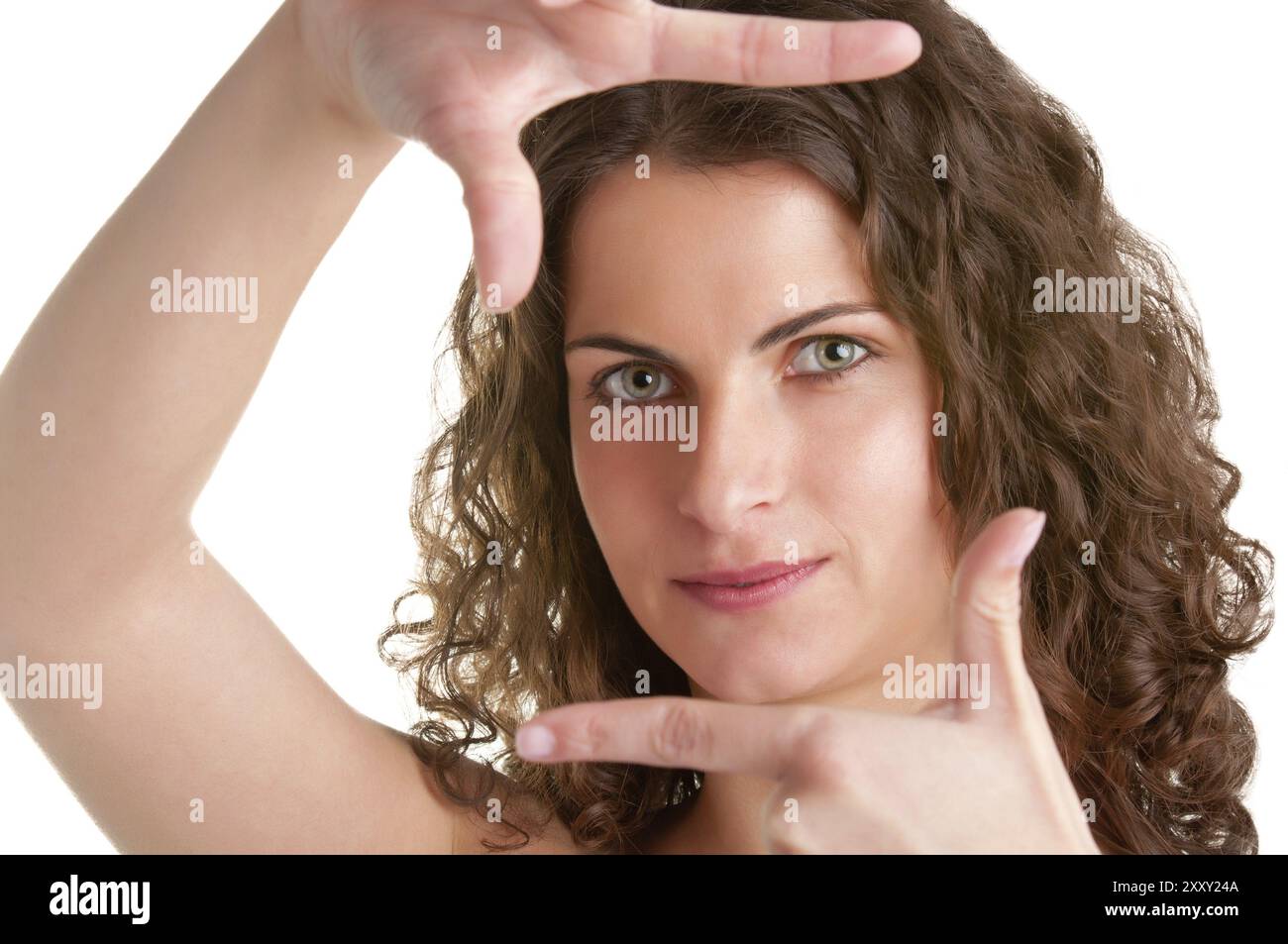 Woman framing a picture with her hands, isolated in white Stock Photo ...