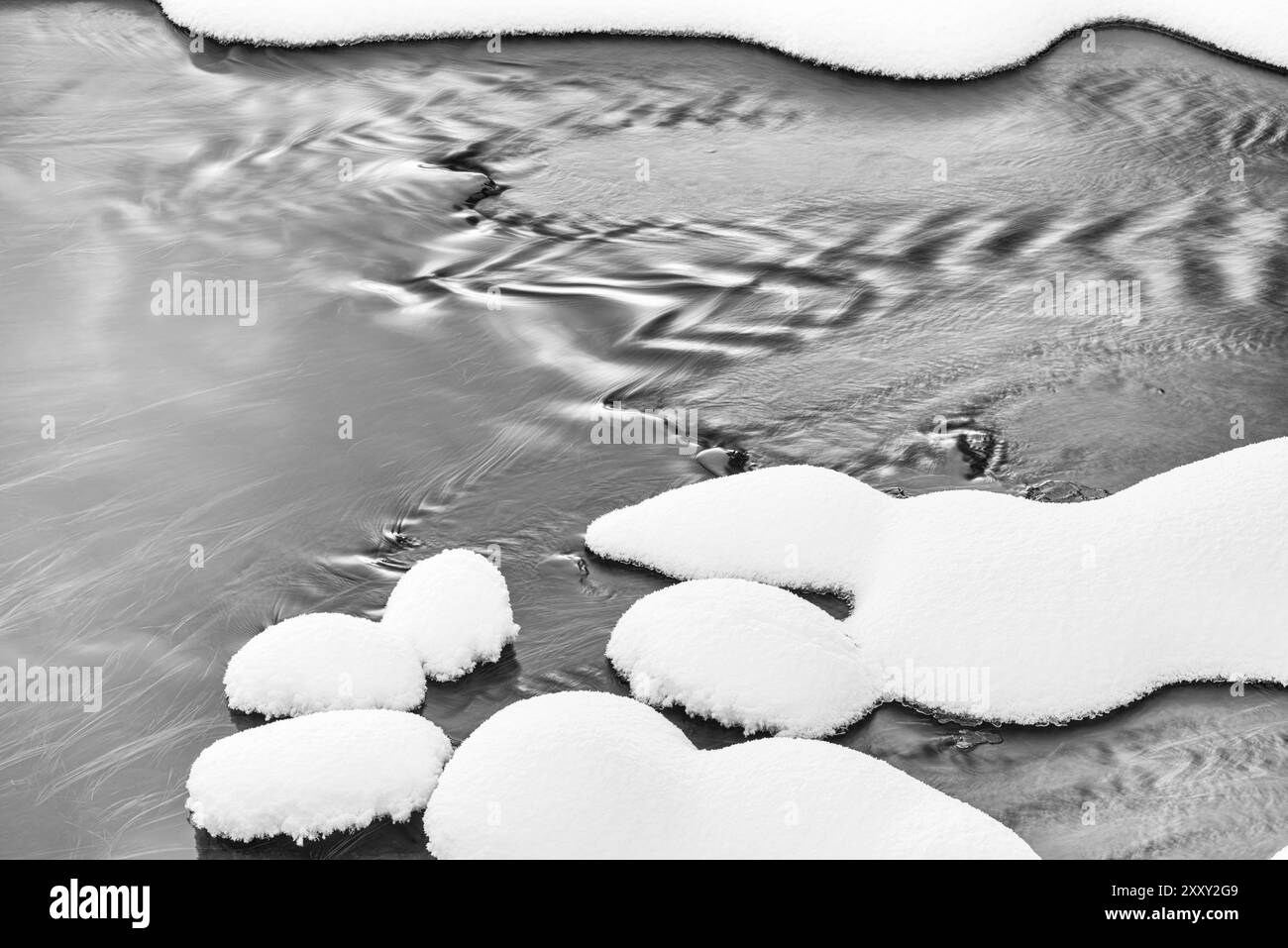 Snow-covered stones in a river, Gaellivare, Norrbotten, Lapland, Sweden ...