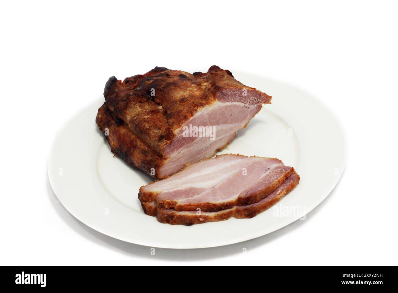 Cut delicious schnitzel on the plate isolated Stock Photo - Alamy