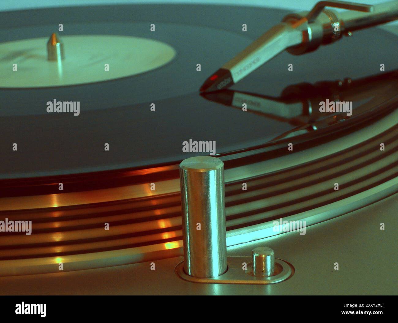 Closeup of a spinning record on a turntable in a club. the highlights ...