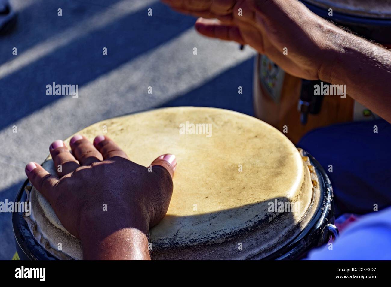 Drum player playing atabaque during presentation of afro music on the ...