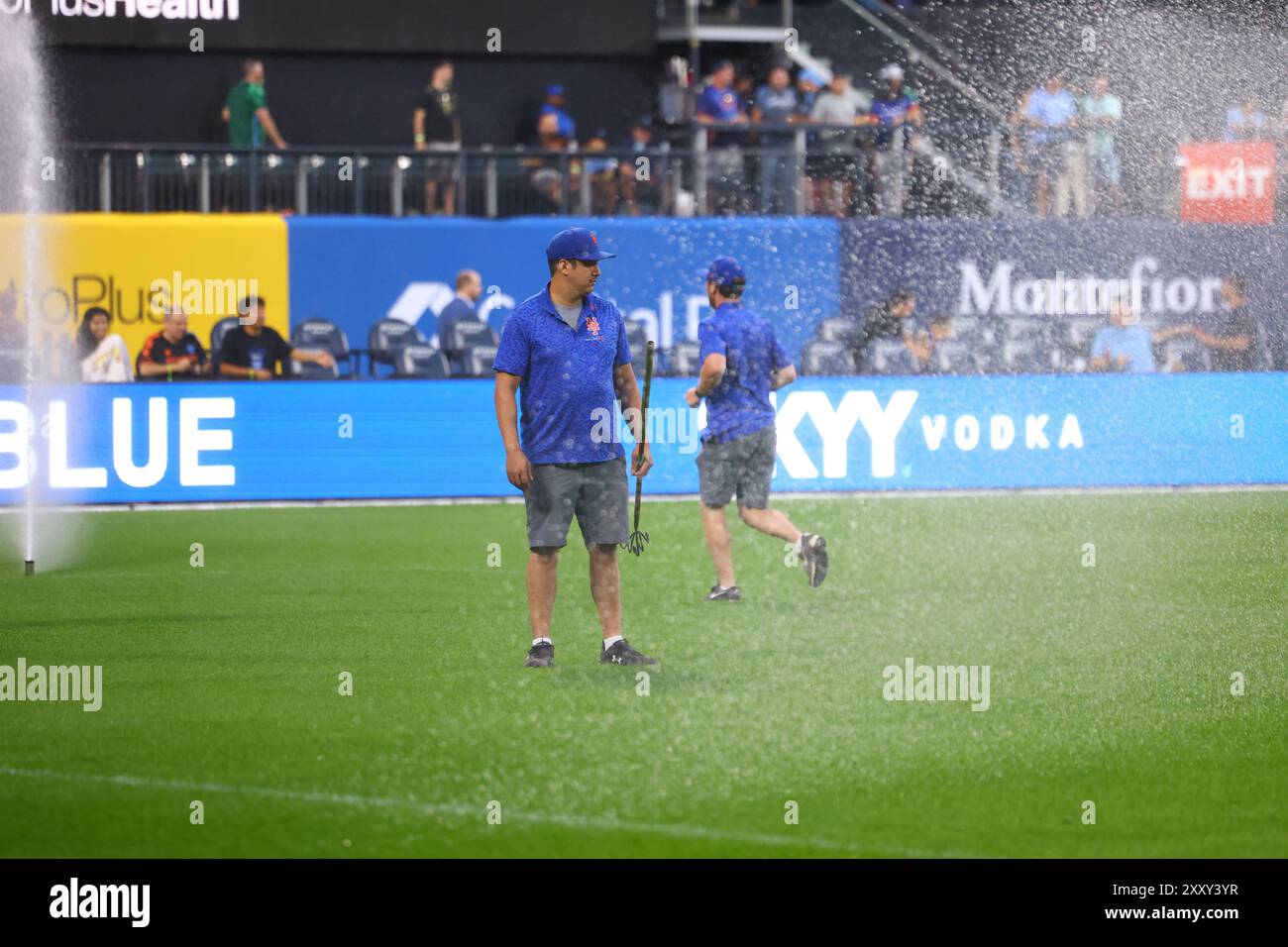 The grounds crew prepares the pitch before the soccer match between the ...