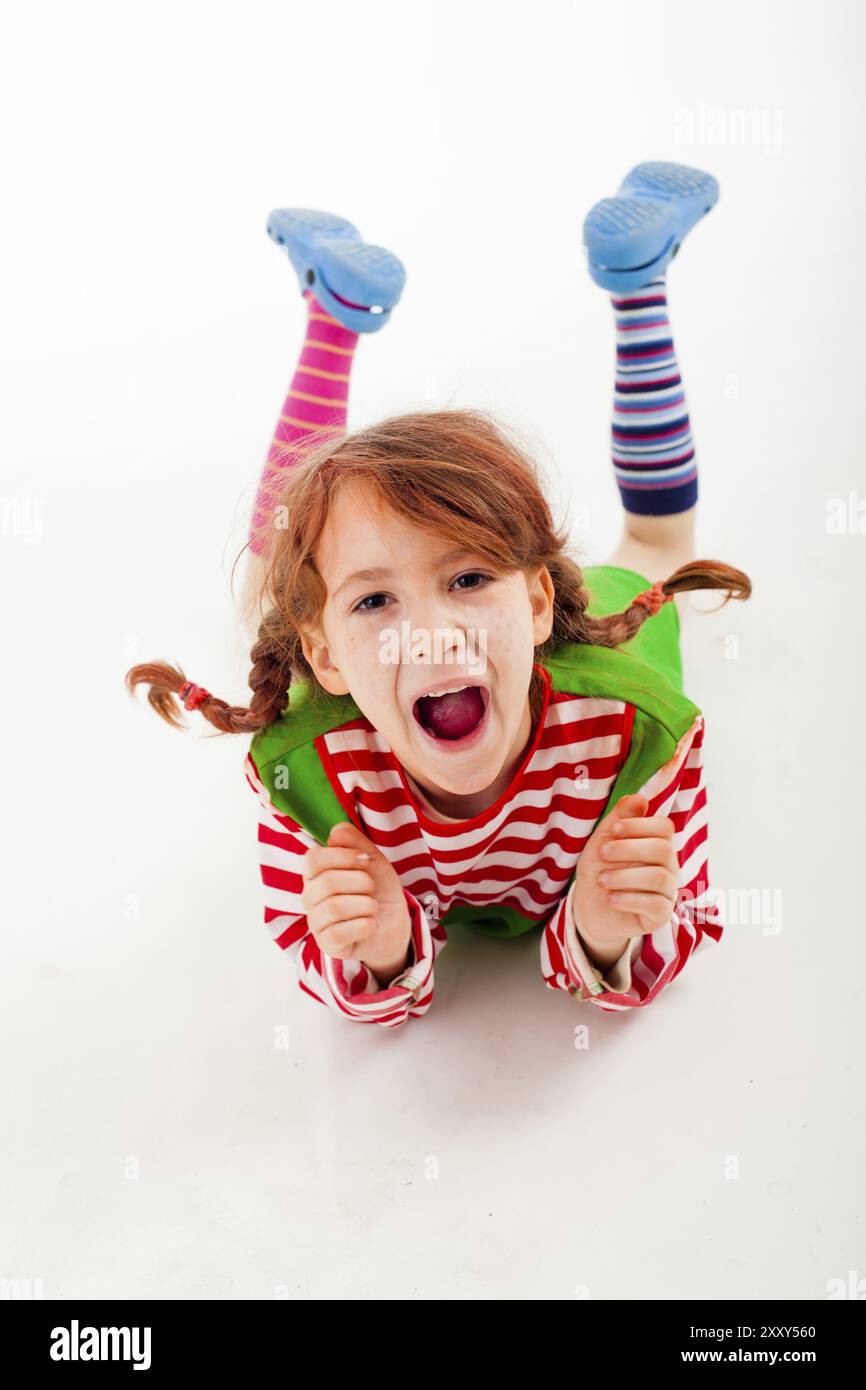 Little girl dressed as Pippi Longstocking with white background Stock ...