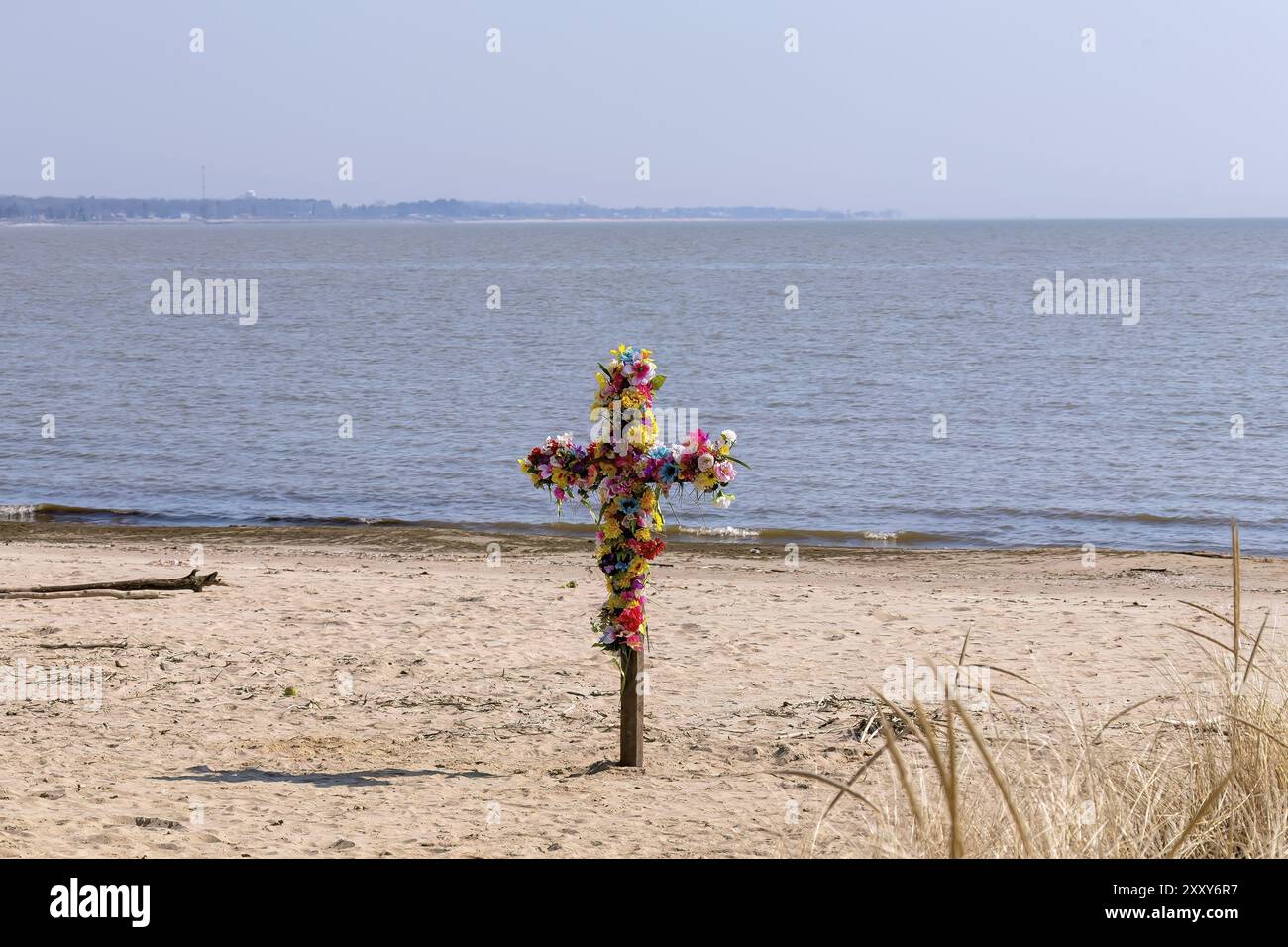 Welcoming spring and celebrating Easter. A floral cross on a public ...