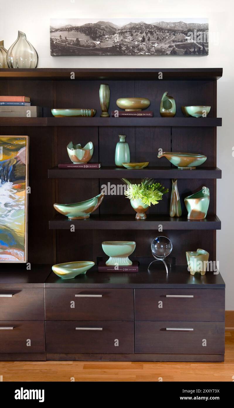 Modern linear bookcase with pottery collection and works of art Stock ...
