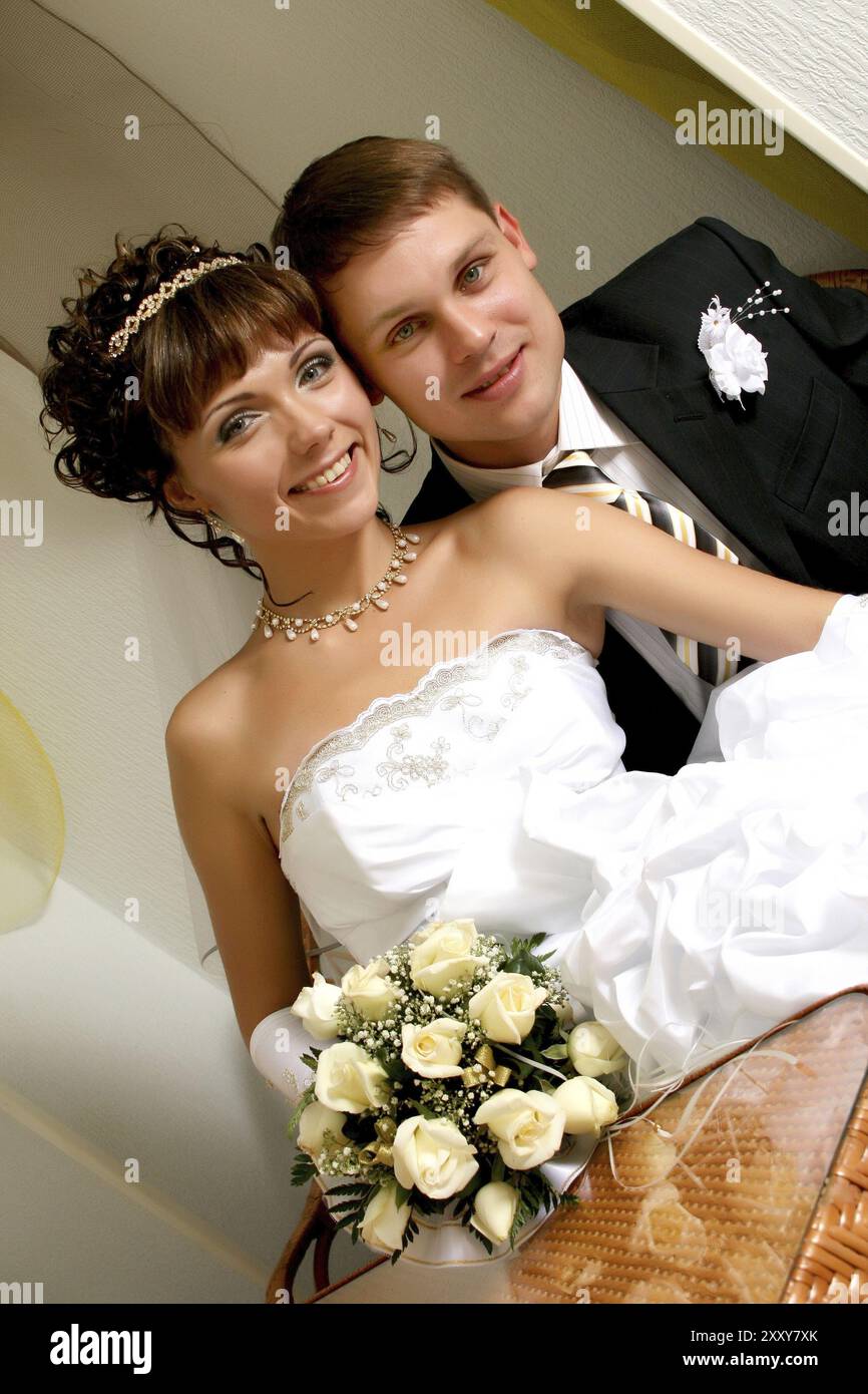 Newly married together in a photo pose Stock Photo - Alamy