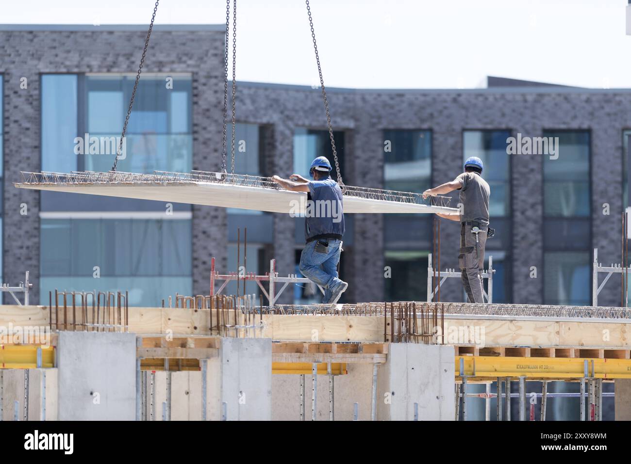 Working on a construction site. Worker in action Stock Photo - Alamy