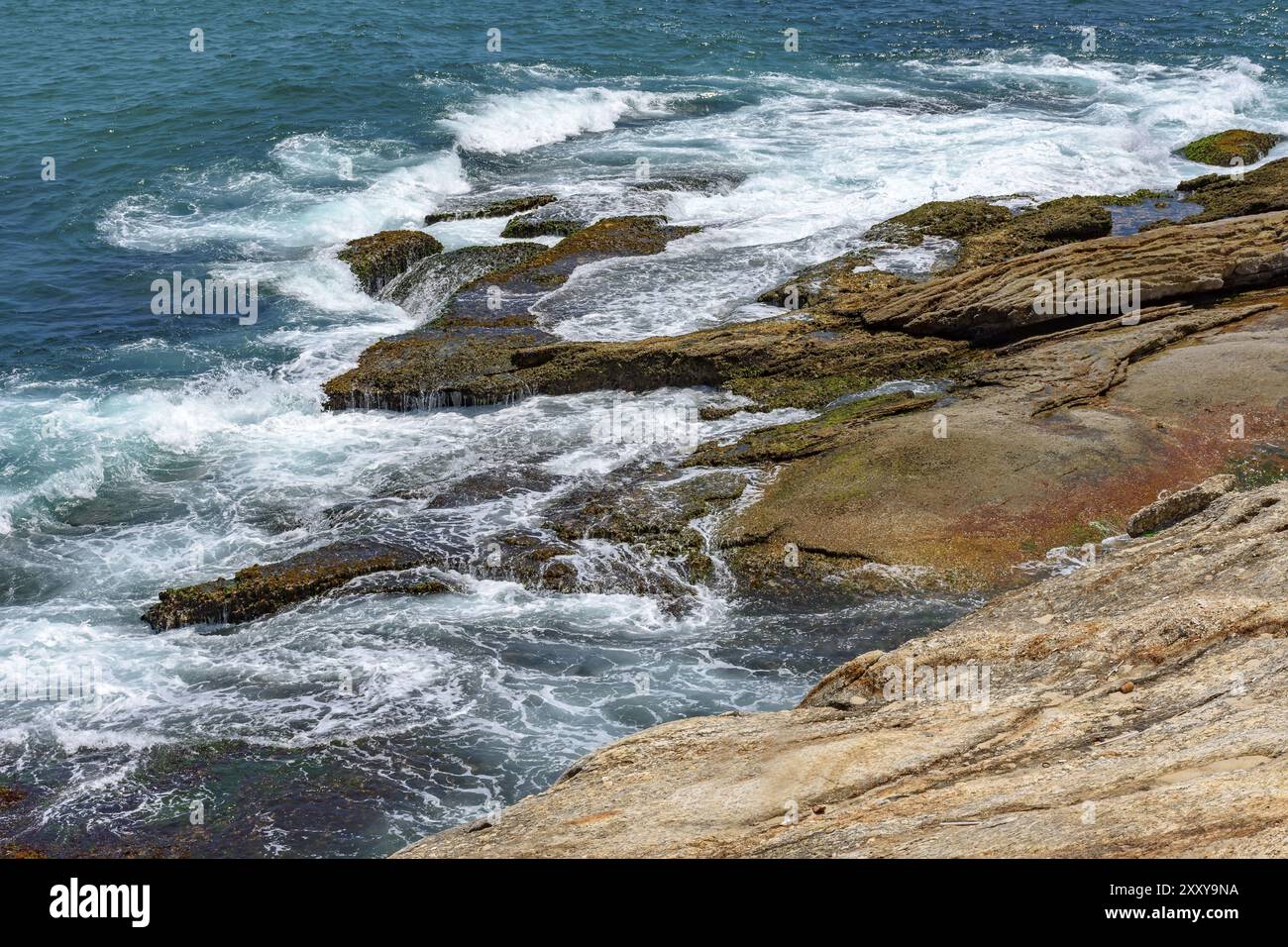Water dripping between rocks in Arpoador Stone, Ipanema, Rio de Janeiro ...