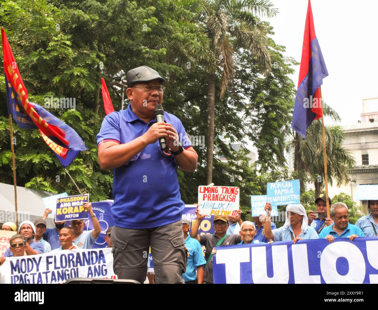 Mody Floranda of transport group, PISTON, speaks to the crowd during ...