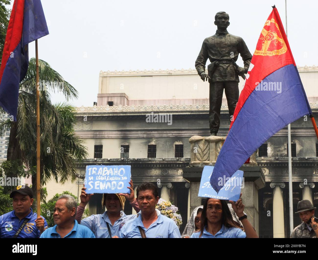 Manila, Philippines. 26th Aug, 2024. Protesters stand in front of the ...