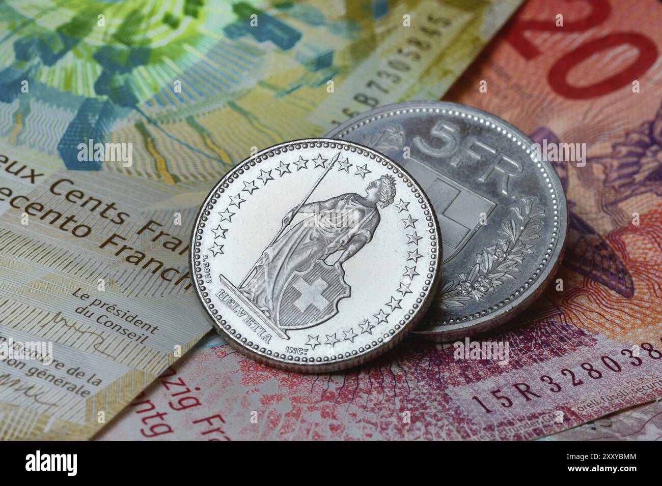 Swiss coins on banknotes, Switzerland, Europe Stock Photo - Alamy