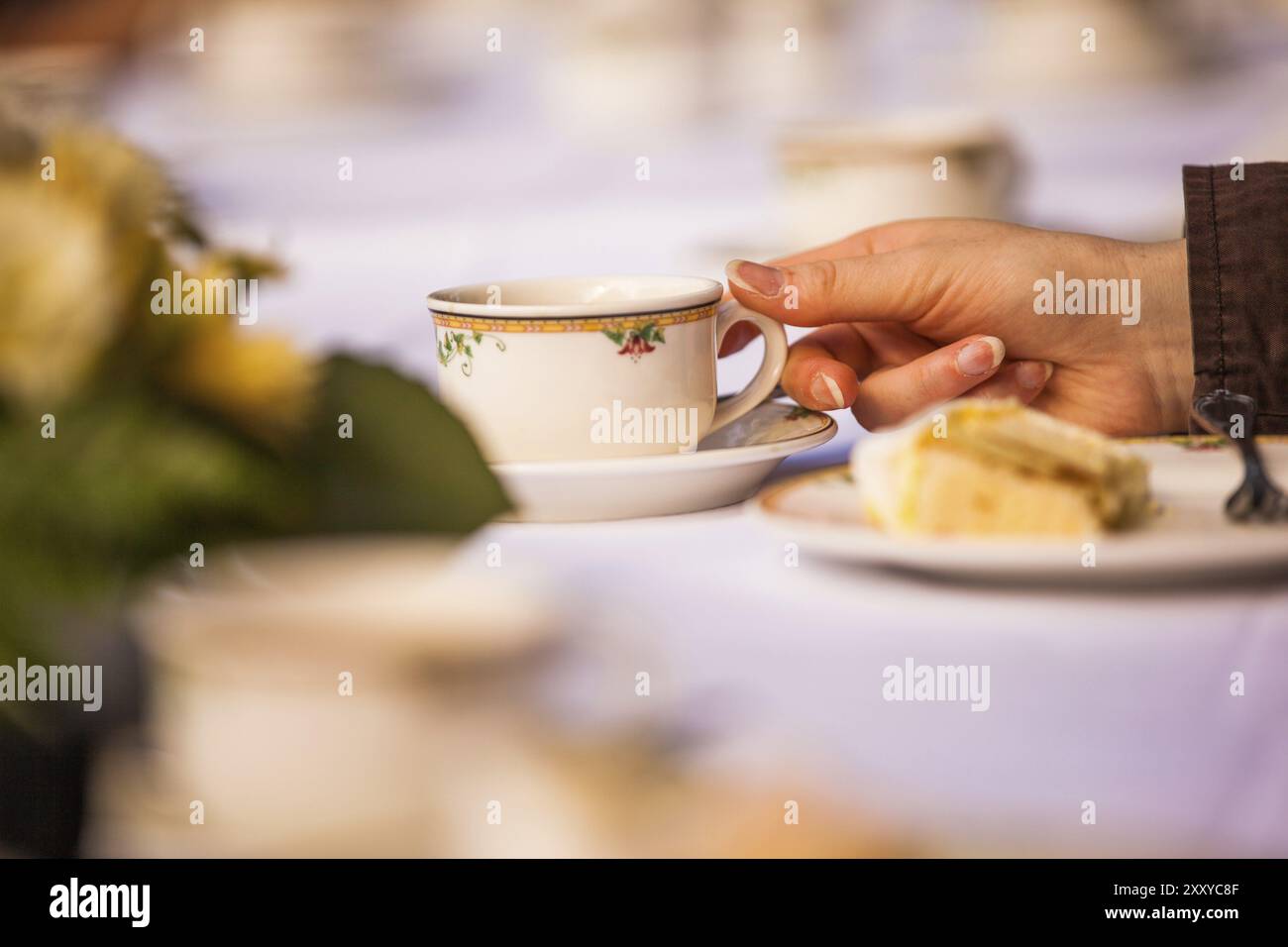 Pick up the cup Stock Photo - Alamy