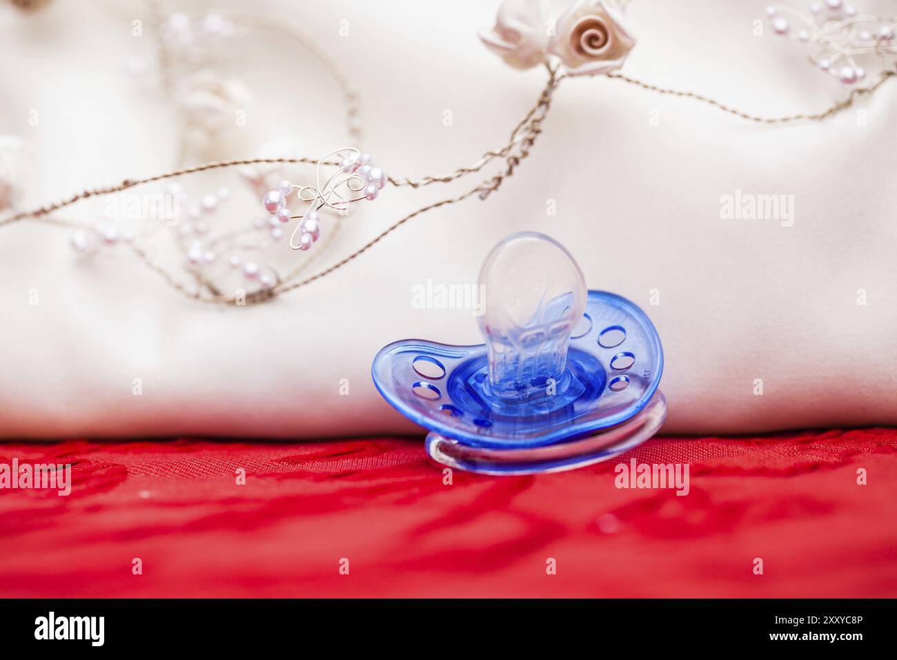 Babys blue pacifier Stock Photo - Alamy