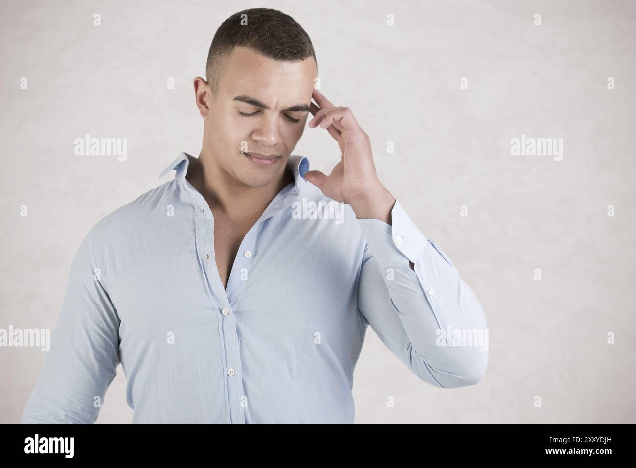 Man suffering from an headache, holding his hand to the head Stock ...