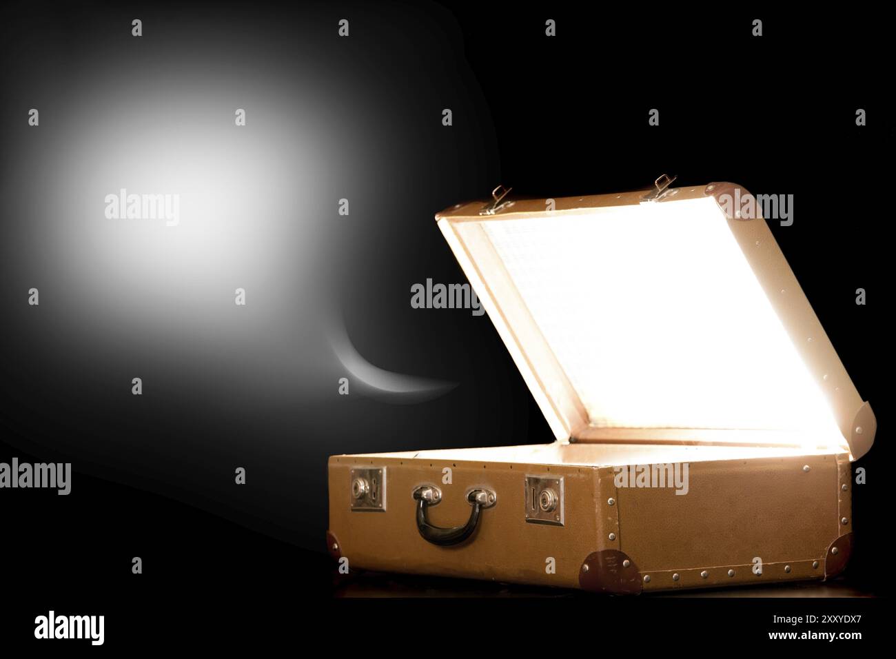 Open suitcase with a cloud of smoke Stock Photo - Alamy