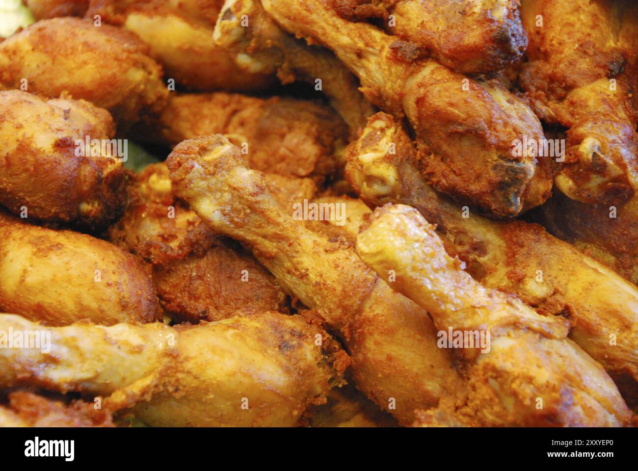 Many stacked hicken legs chicken drumsticks on a buffet Stock Photo - Alamy