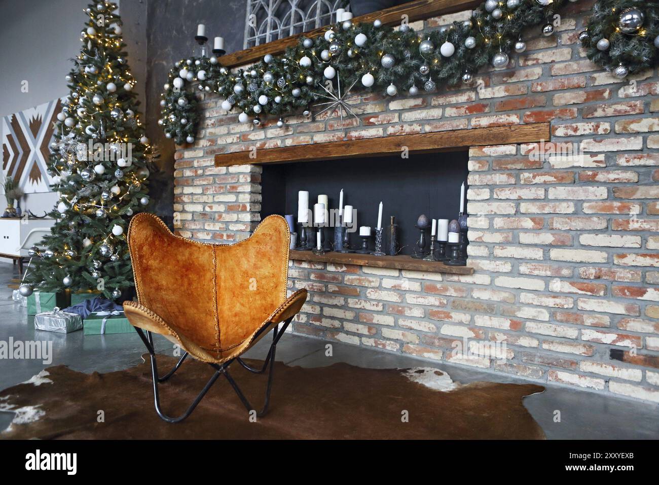 Christmas decorated fireplace and tree in the loft room Stock Photo - Alamy