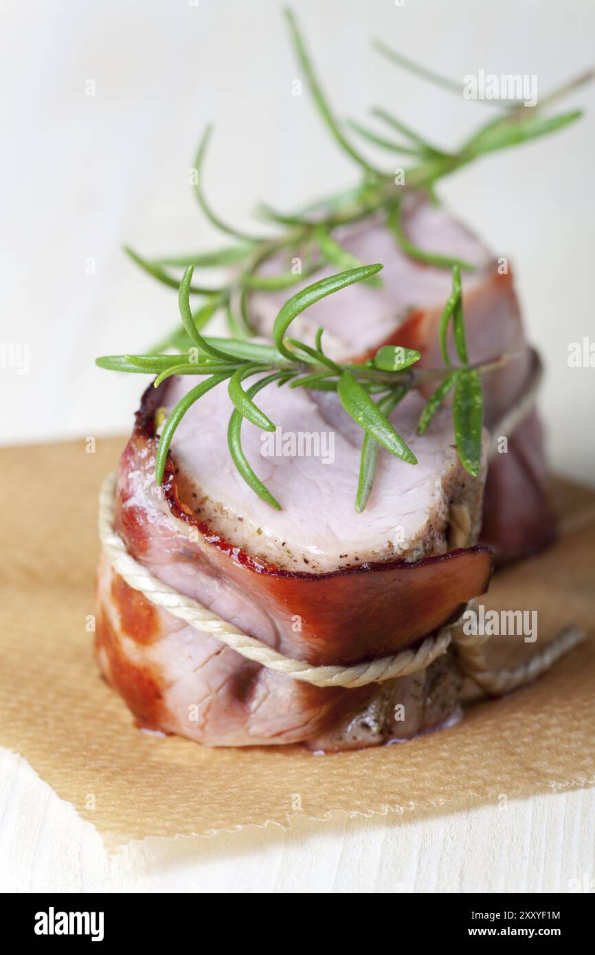 Grilled pork wrapped in ham Stock Photo - Alamy